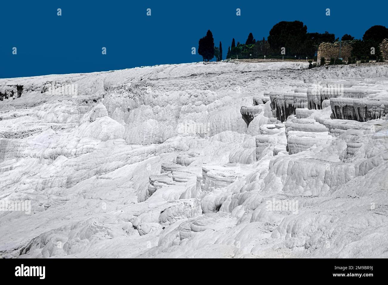 View of natural travertine pools and terraces in Pamukkale. Cotton ...