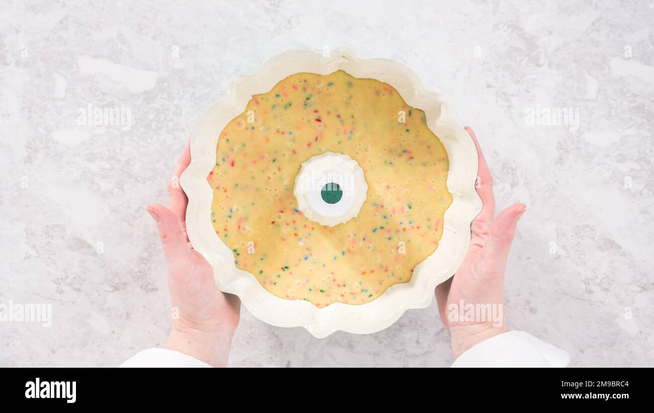 Flat lay. Step by step. Pouring cake batter into a bundt cake pan to ...