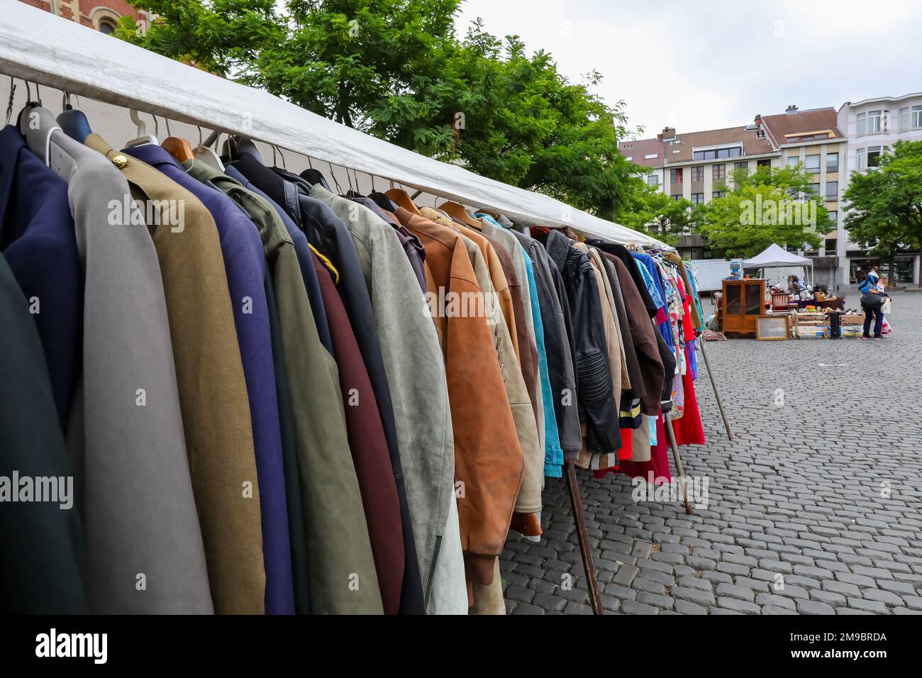many used vintage clothes for sale at stand of alfresco flea market ...