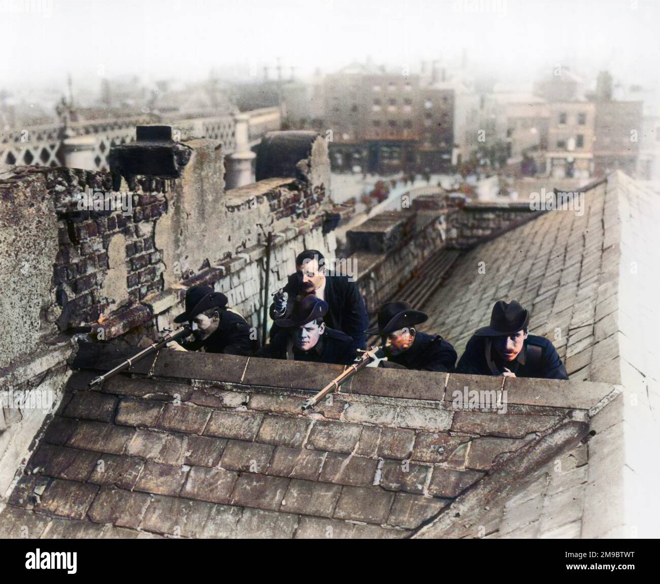 Irish Citizen Army soldiers on rooftops in Dublin before the Easter ...
