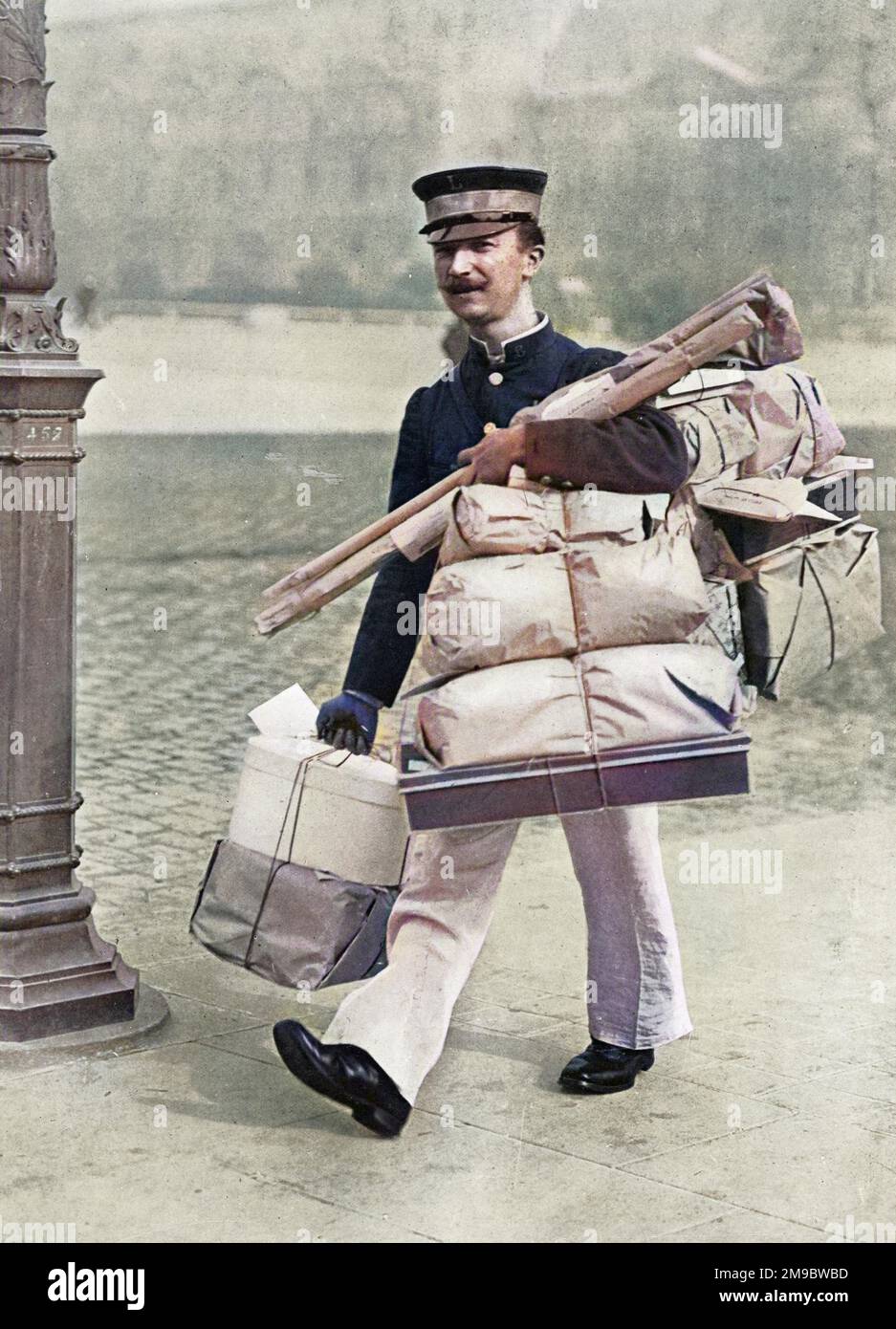 A busy parcel delivery man in Paris seen hard at work during the ...