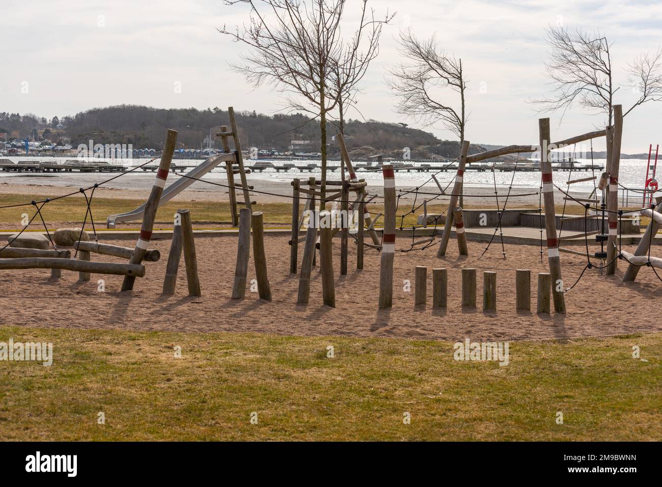 Wooden obstacle course at a playground by a beach Stock Photo - Alamy