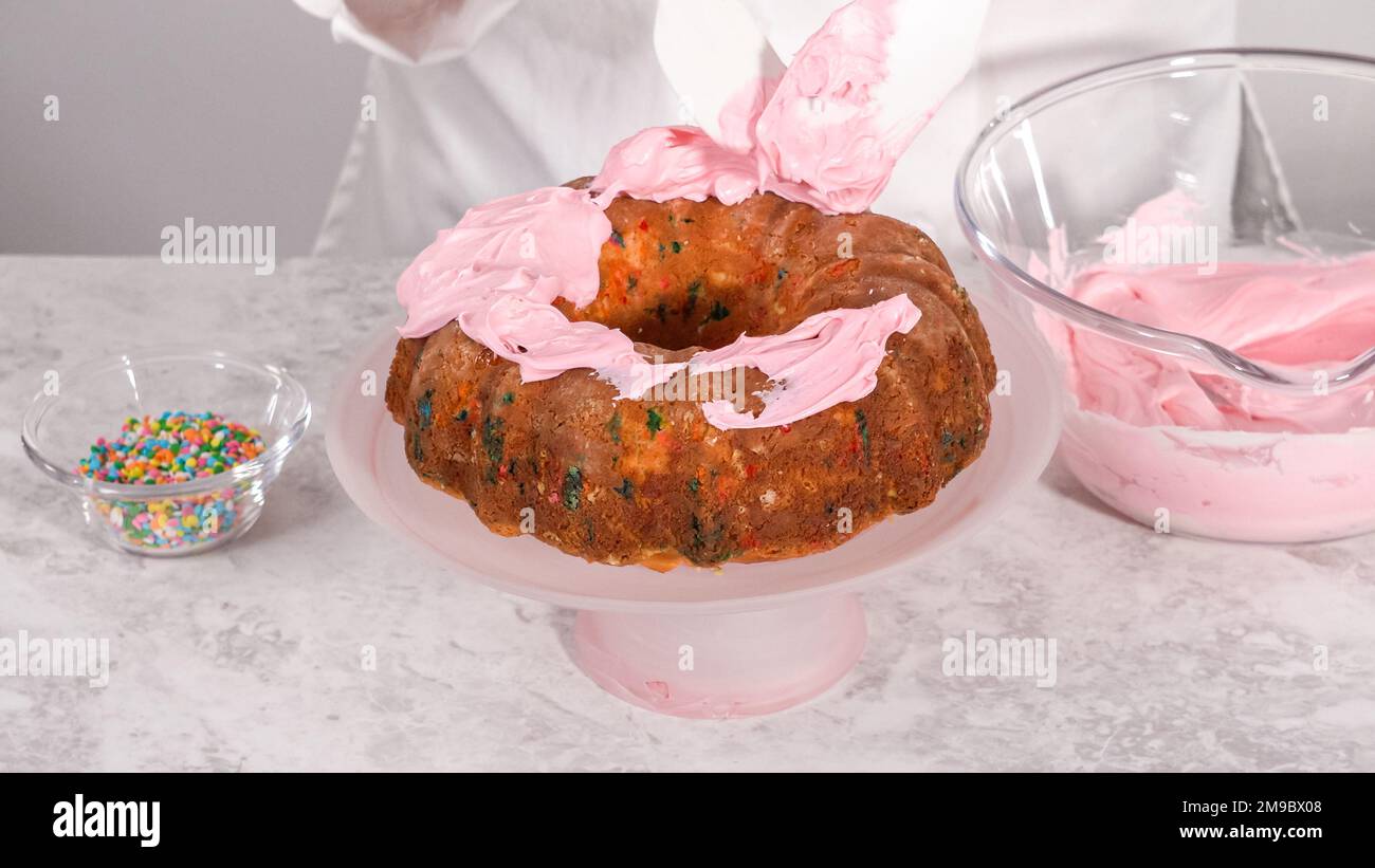 Step by step. Frosting funfetti bunt cake with pink buttercream icing ...