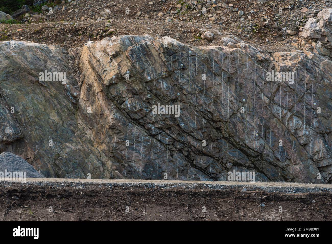 Cut stone by a newly constructed highway Stock Photo - Alamy