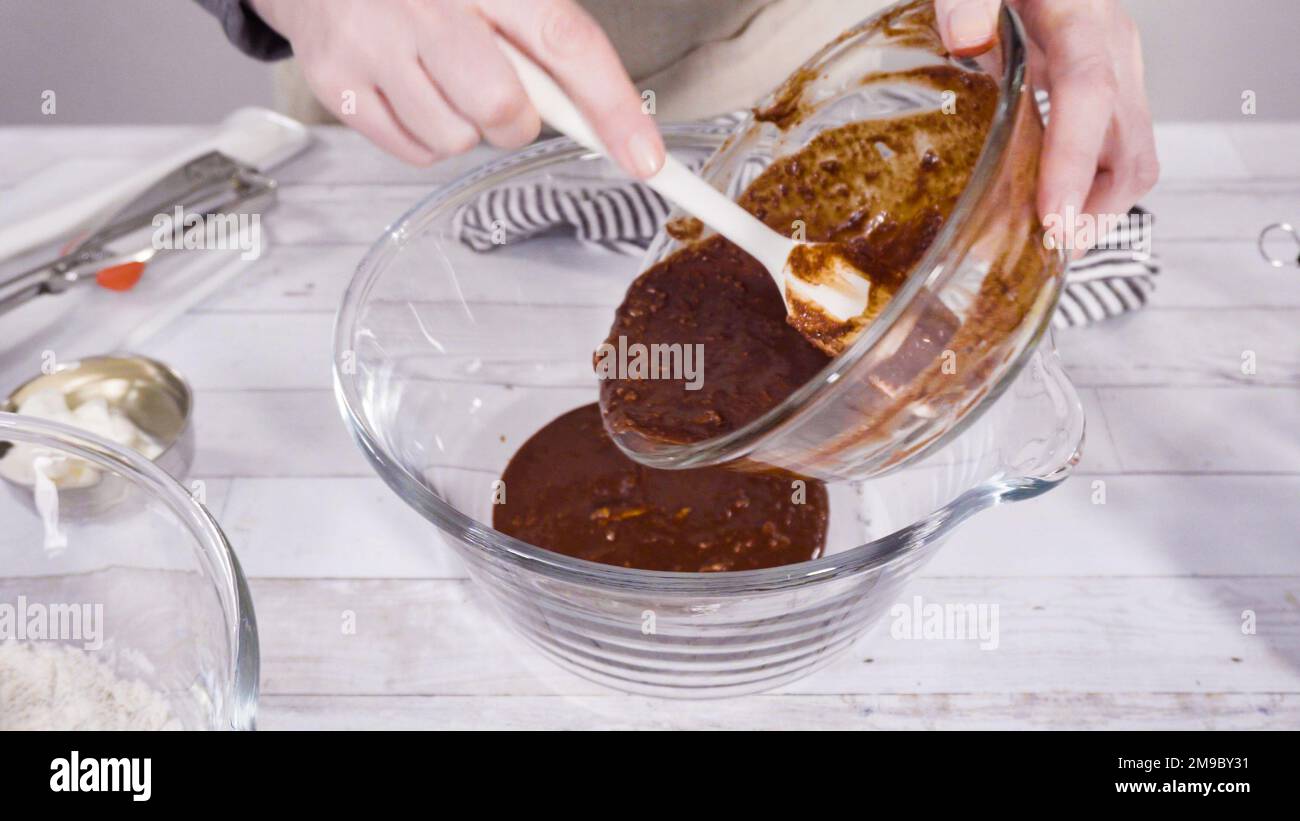 Mixing ingredients to bake chocolate raspberry cupcakes Stock Photo - Alamy