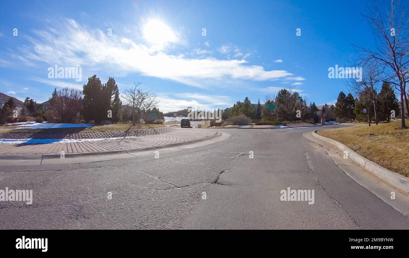 Driving on typical paved roads in a suburban upscale residential ...