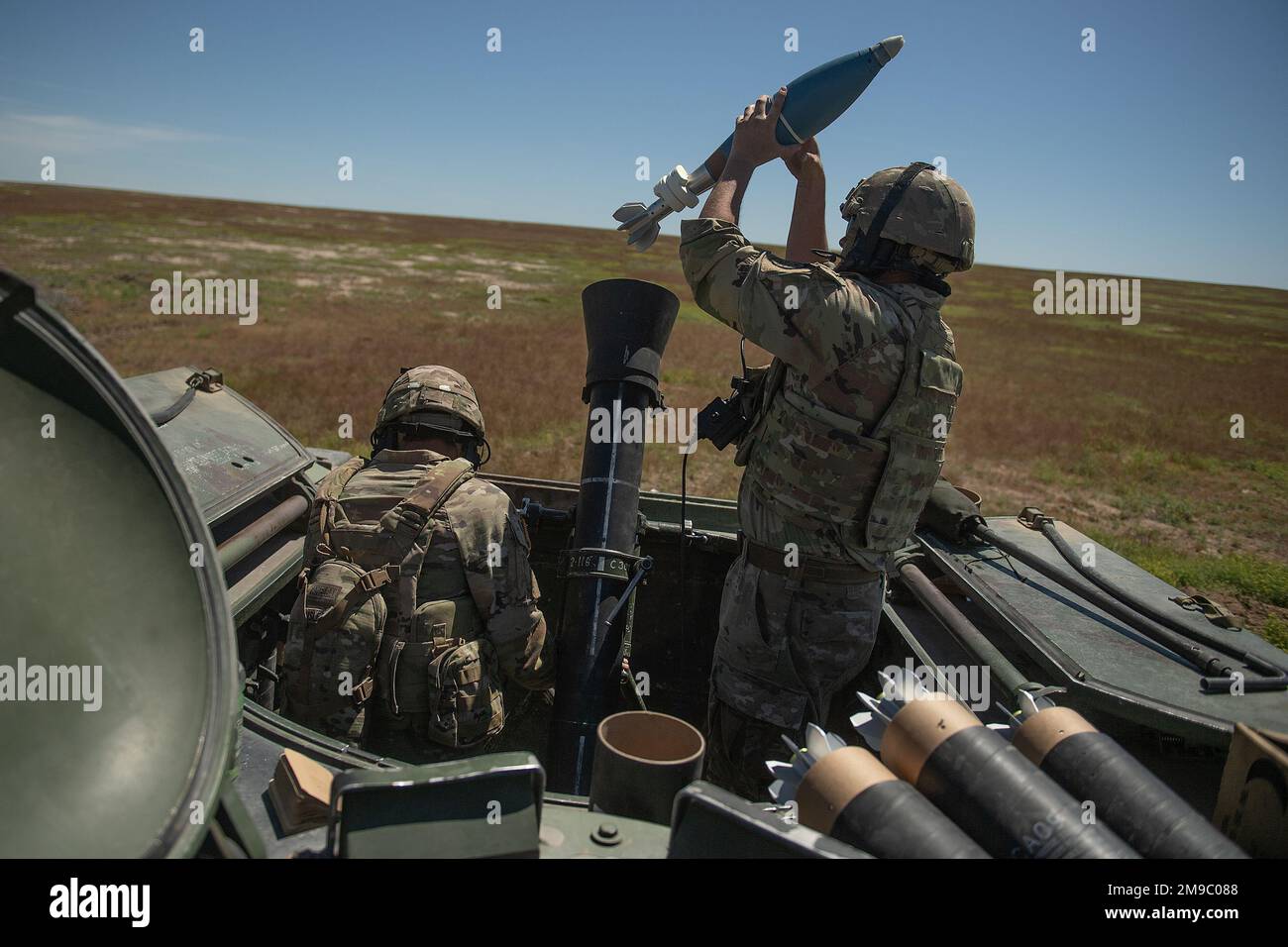 Idaho Army National Guard Spc. Devin Wine,(right) assistant gunner ...