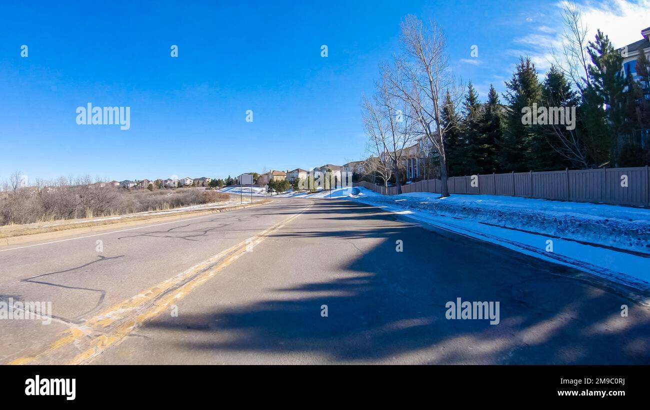 Driving on typical paved roads in a suburban upscale residential ...
