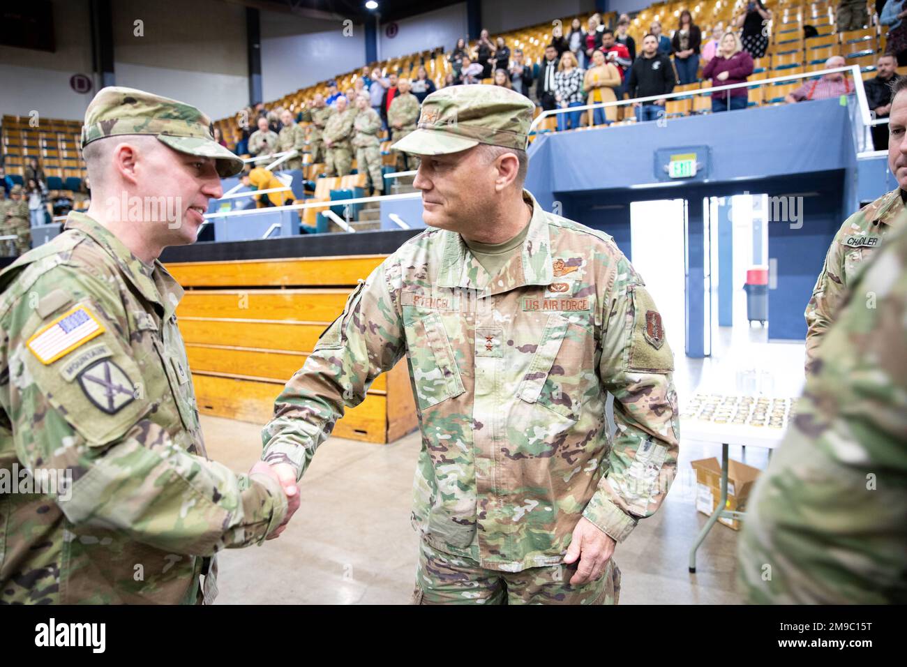 Oregon National Guard Maj. Gen. Mike Stencel, The Adjutant General, Oregon, shakes hands with ...