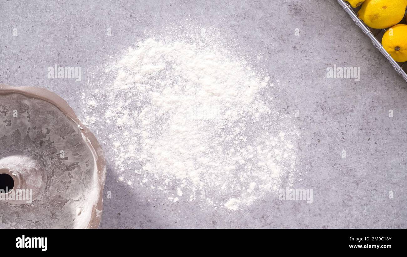 Flat lay. Step by step. Greasing bundt cake pan to bake lemon cranberry ...