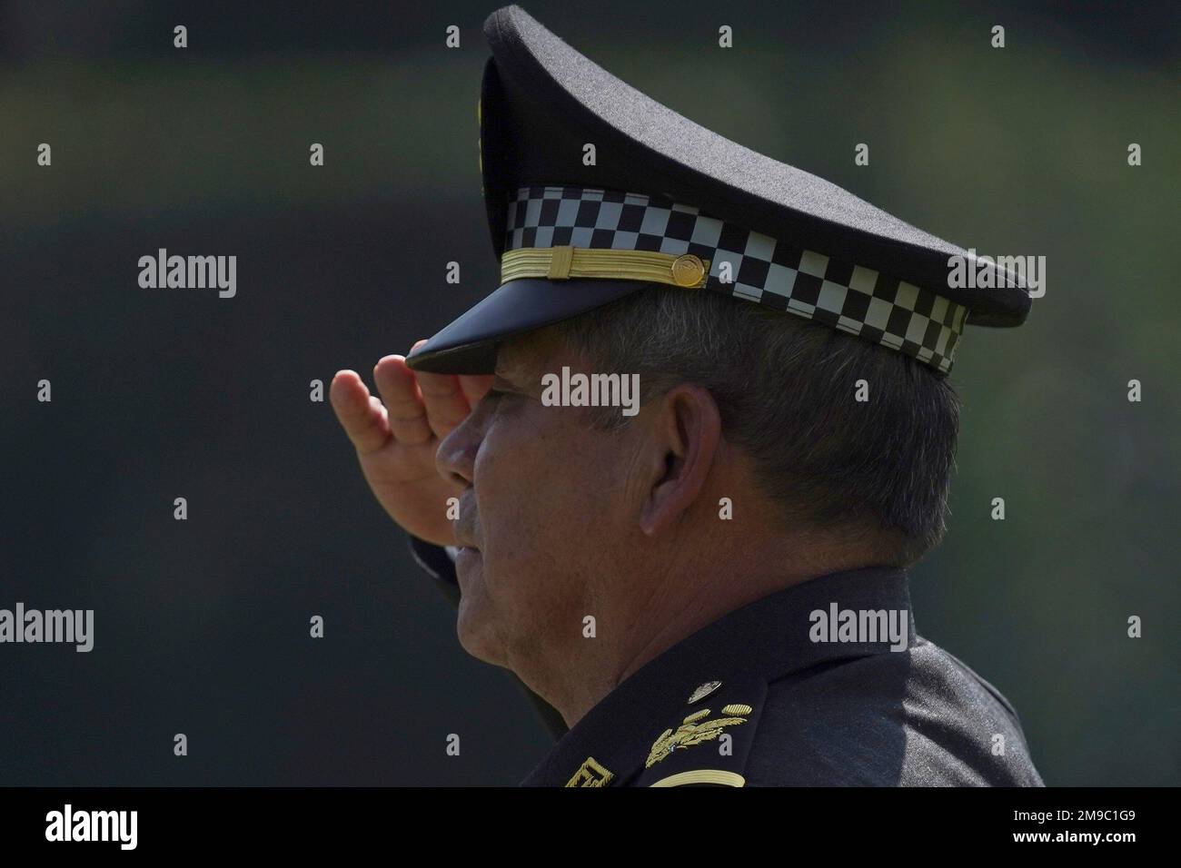 General David Cordova Campos salutes the Mexican flag after taking ...