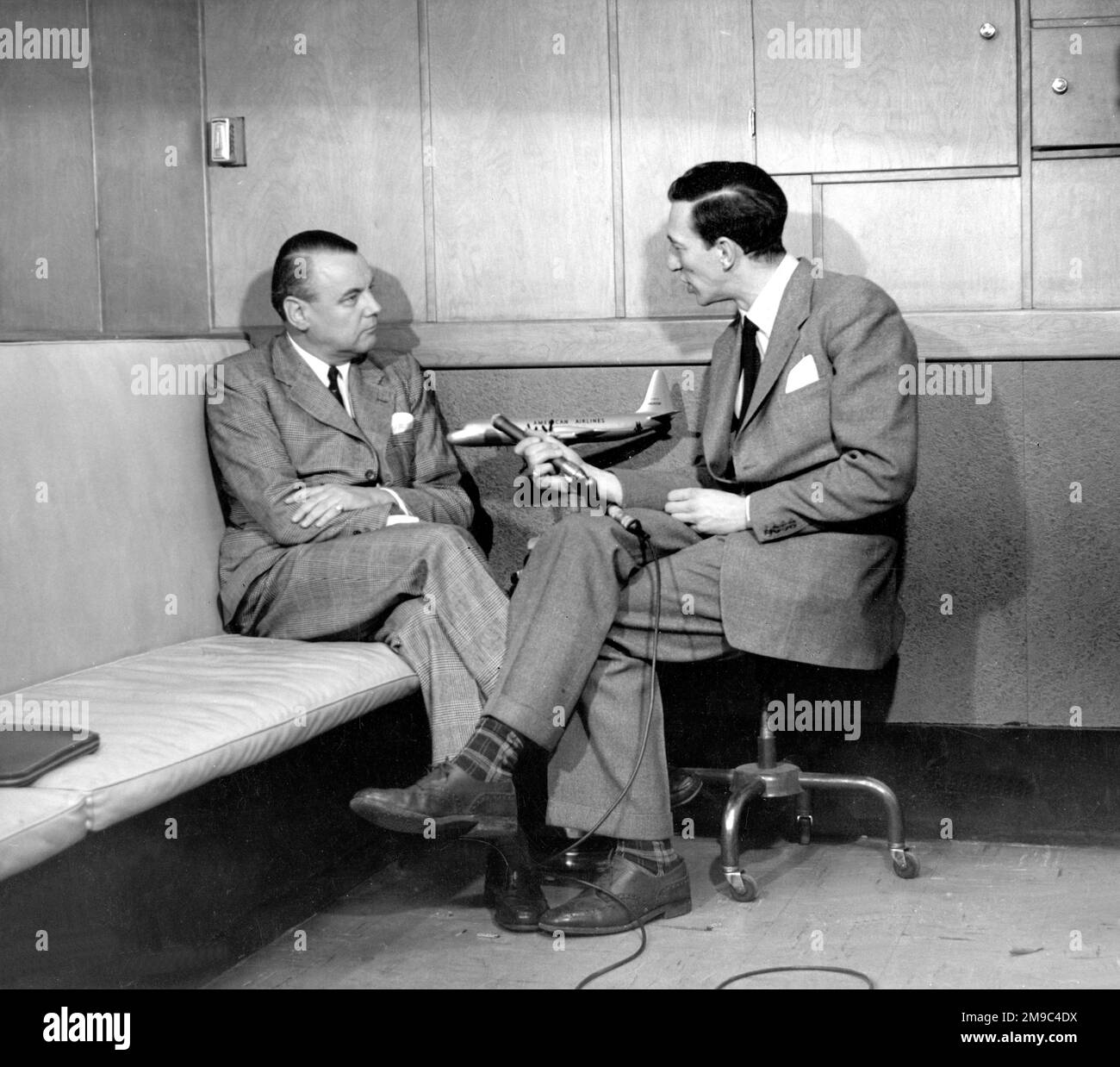 Raymond Baxter conducting an interview with an American Airlines ...