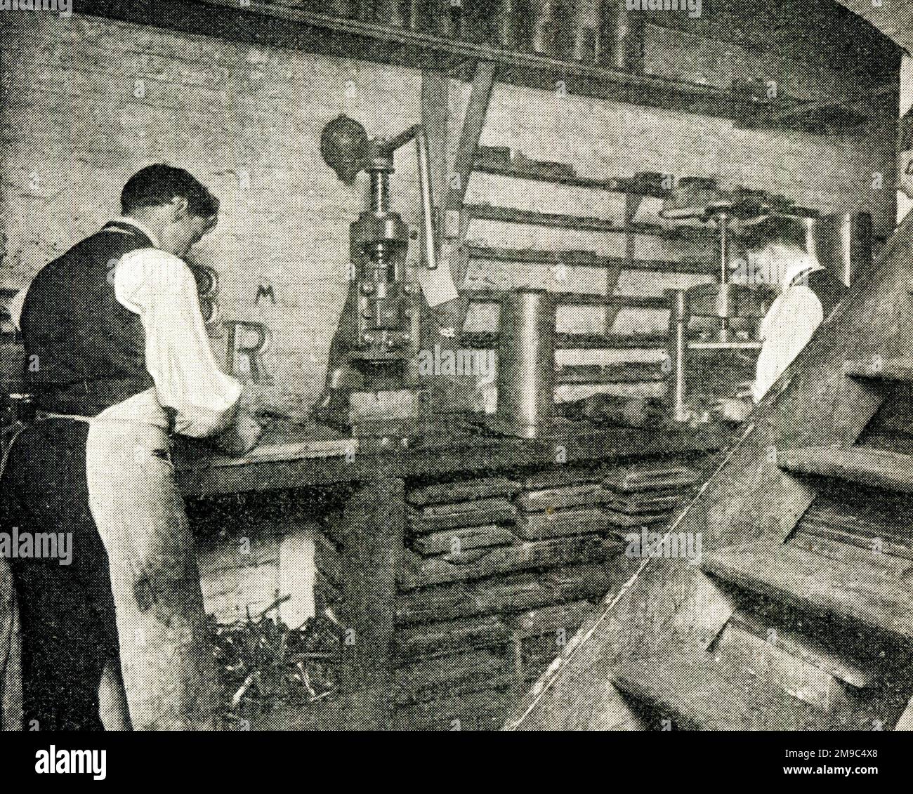 A corner of the Stamping Room, Pether's Sign Makers, London Stock Photo ...