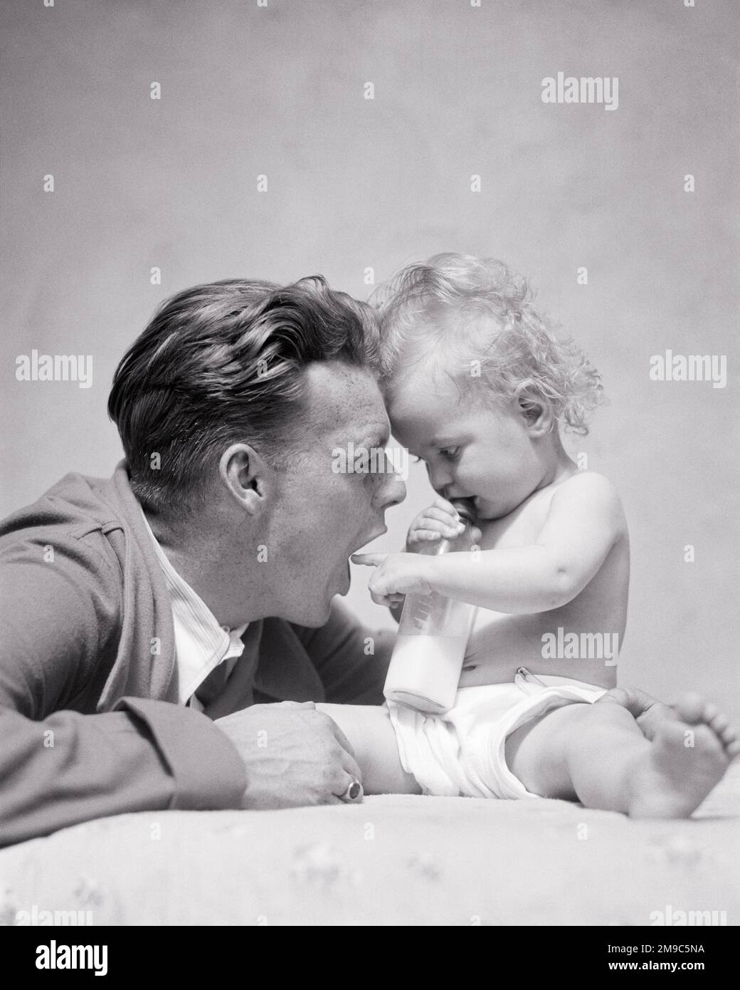 1950s father and baby hi-res stock photography and images - Alamy