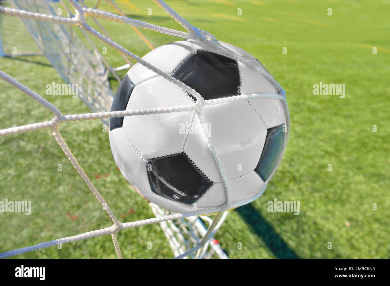 Soccer ball in net hi-res stock photography and images - Alamy