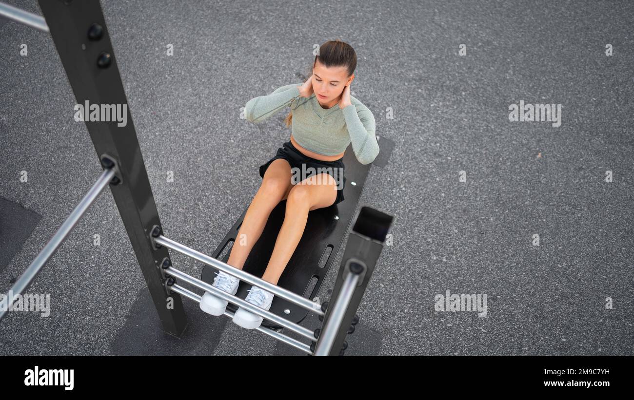 Sit-ups exercises. Active, fit sporty woman doing situps, exercising ...