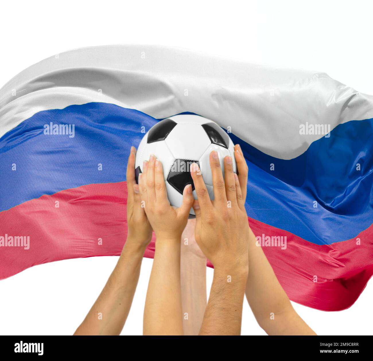 Group of football players holding a soccer ball at football stadium ...