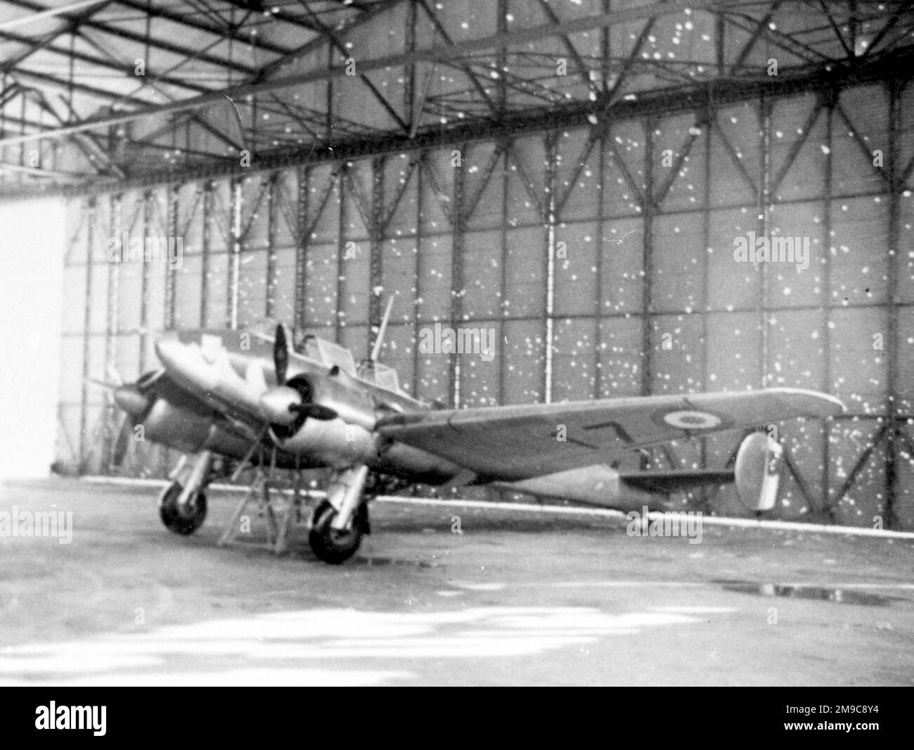 A Potez 633 B.2, sat in a peppered hangar, after capture by German ...
