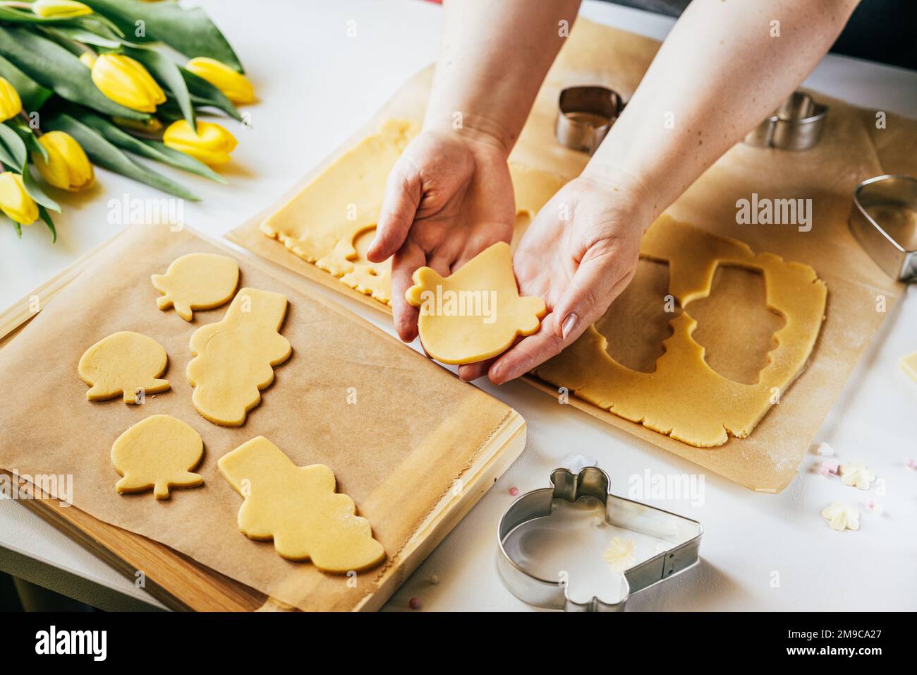 Female hands cutting pastry dough into lolly ice cream shape Stock ...