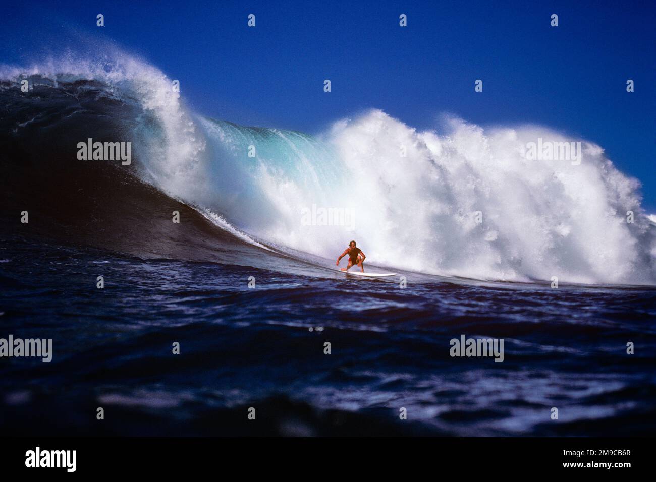 1980s SURFER ON BIG WAVE IN WAIMEA BAY ON NORTH SHORE OF OAHU HAWAII ...