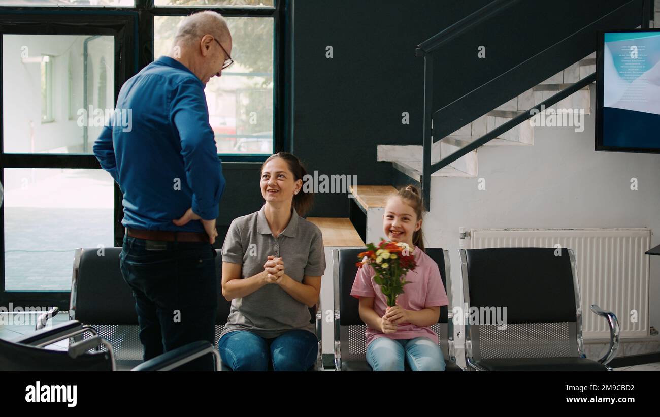 Elderly man feeling healthy after examination, walking after using ...