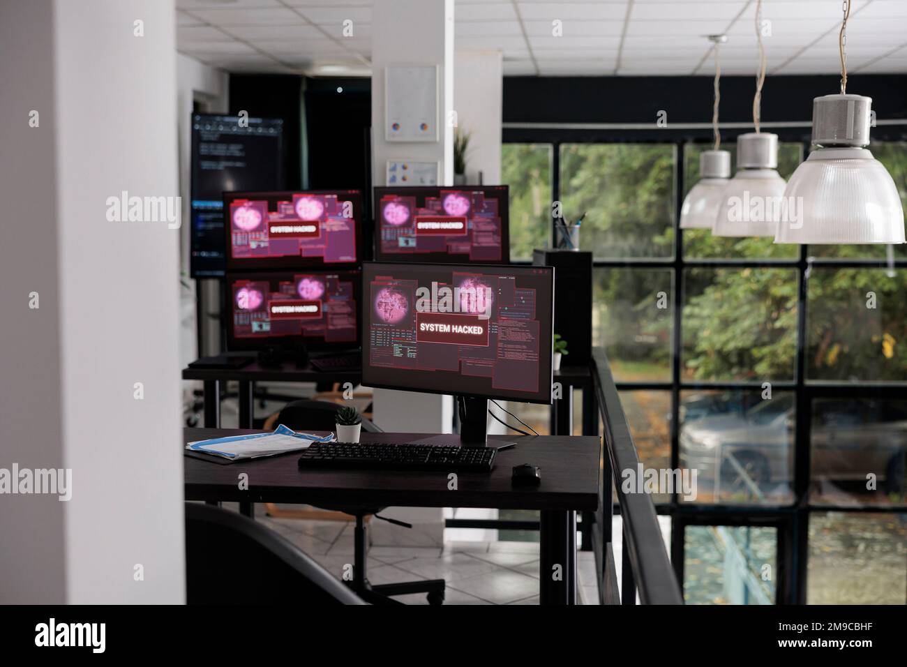 Empty Office With Computer Monitors Showing Hacking Warning Alert After Security Breach Cyber