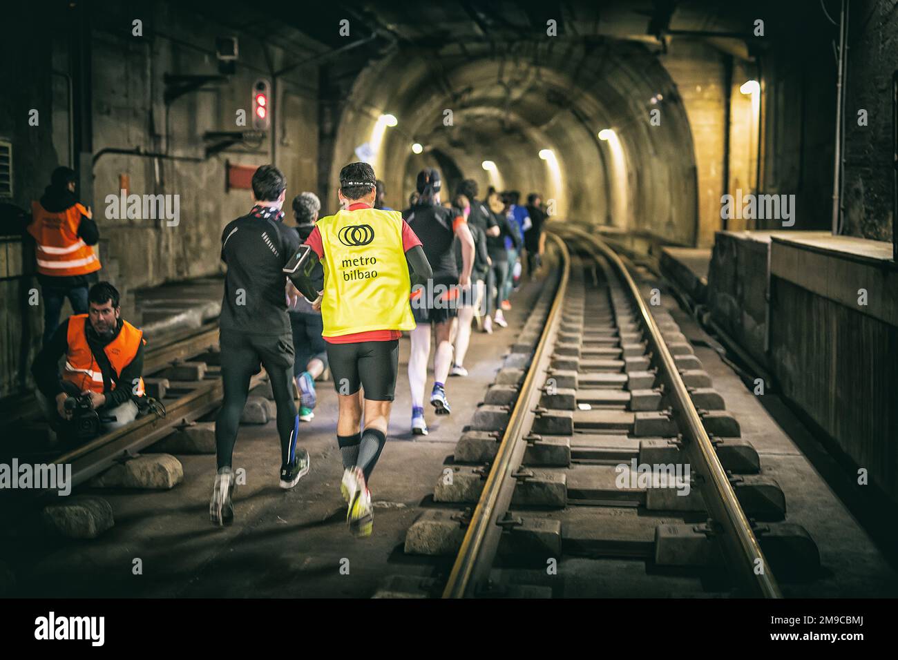 Runners running in a race in the Bilbao subway Stock Photo - Alamy
