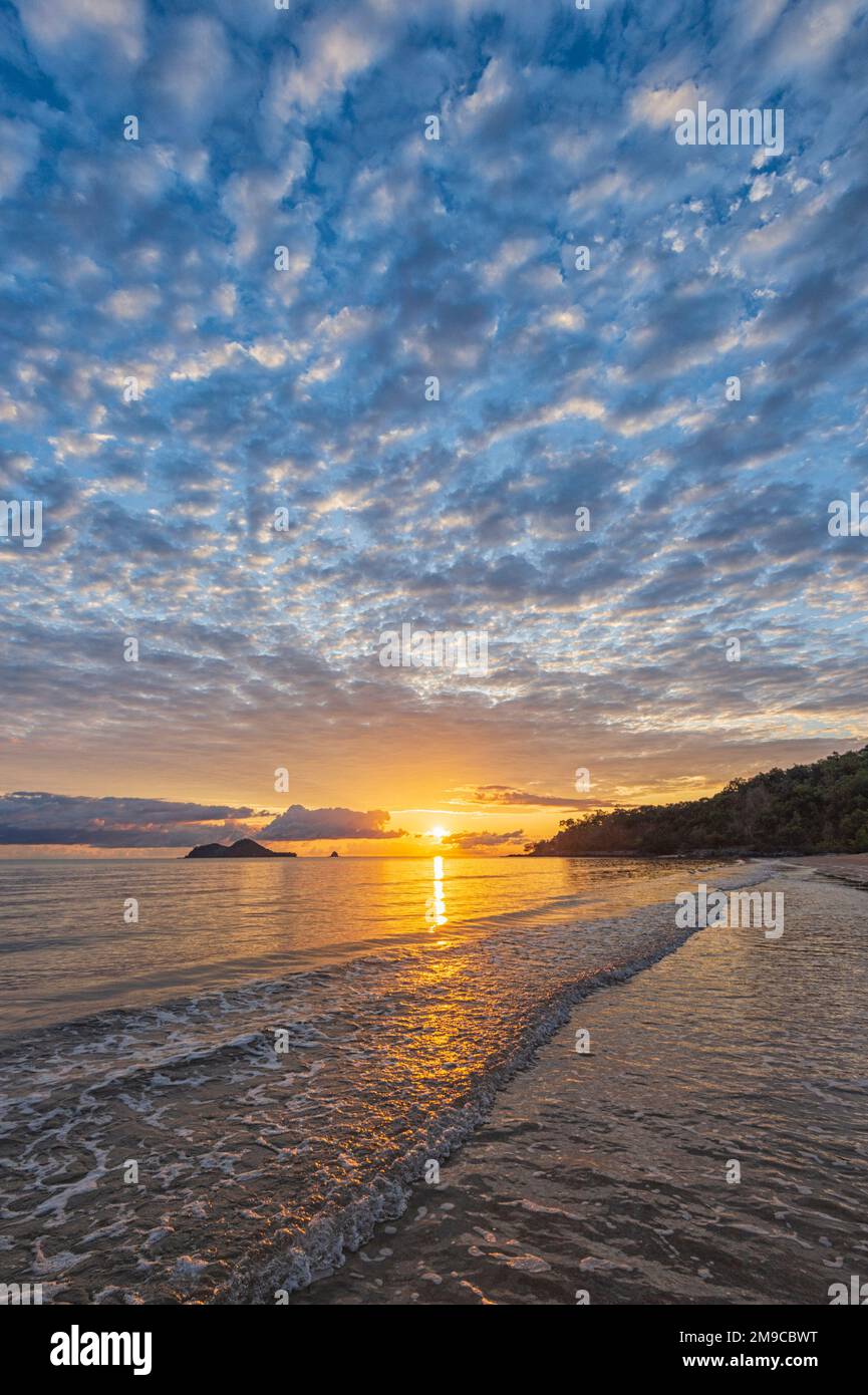 Scenic vertical view of a spectacular sunrise over popular Ellis Beach ...