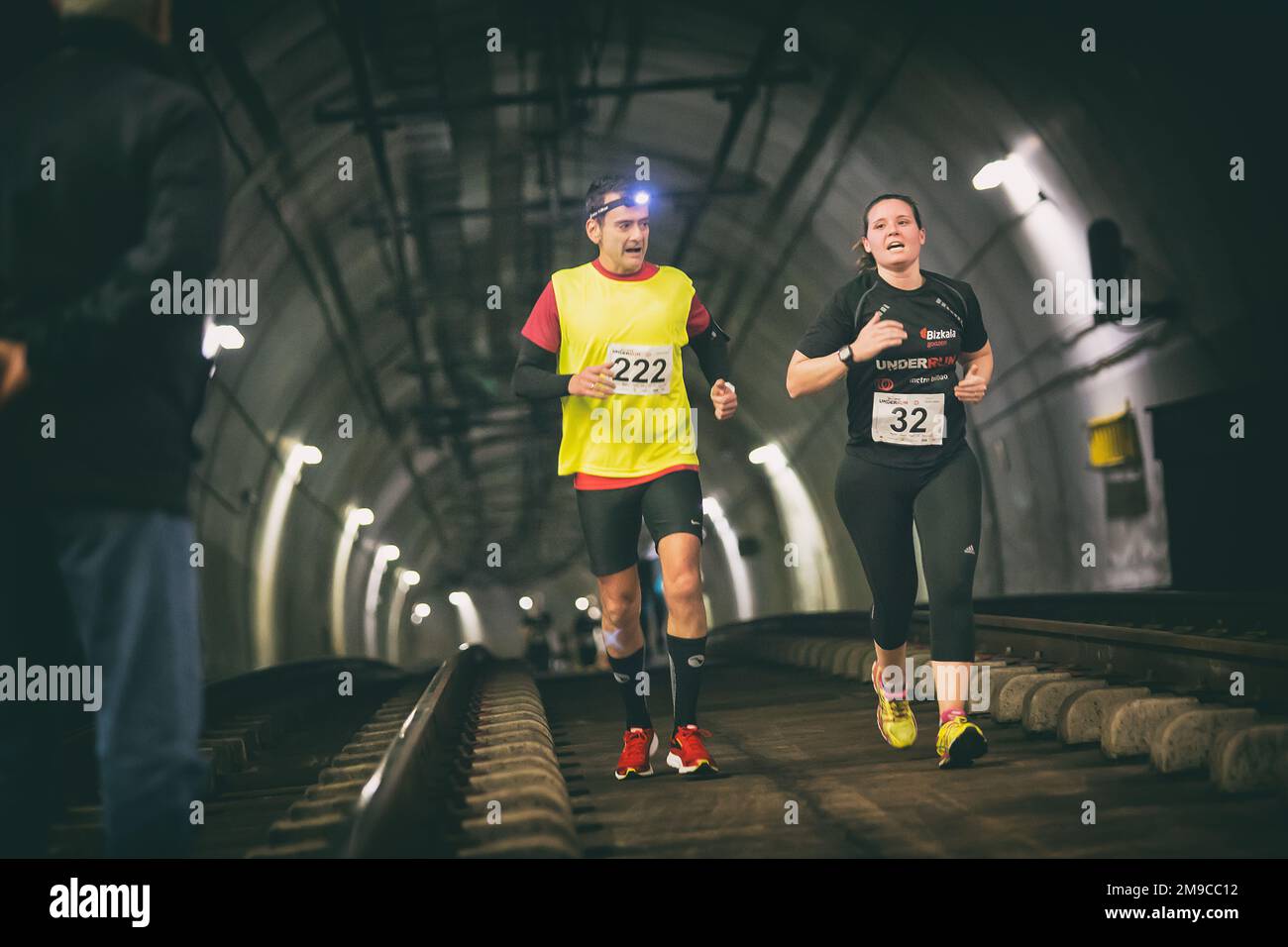 Runners running in a race in the Bilbao subway Stock Photo - Alamy
