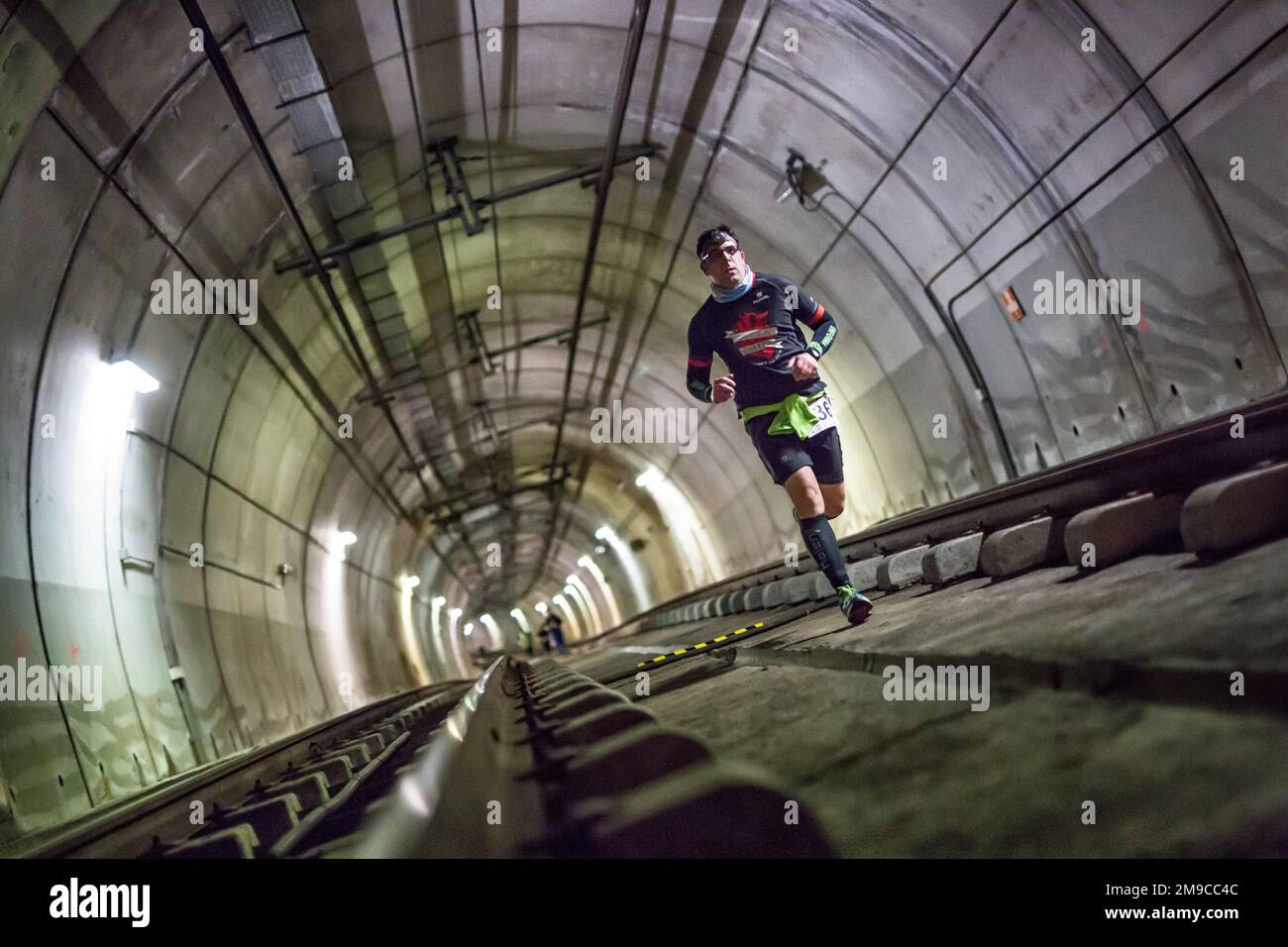 Runner running in a race in the Bilbao subway Stock Photo - Alamy