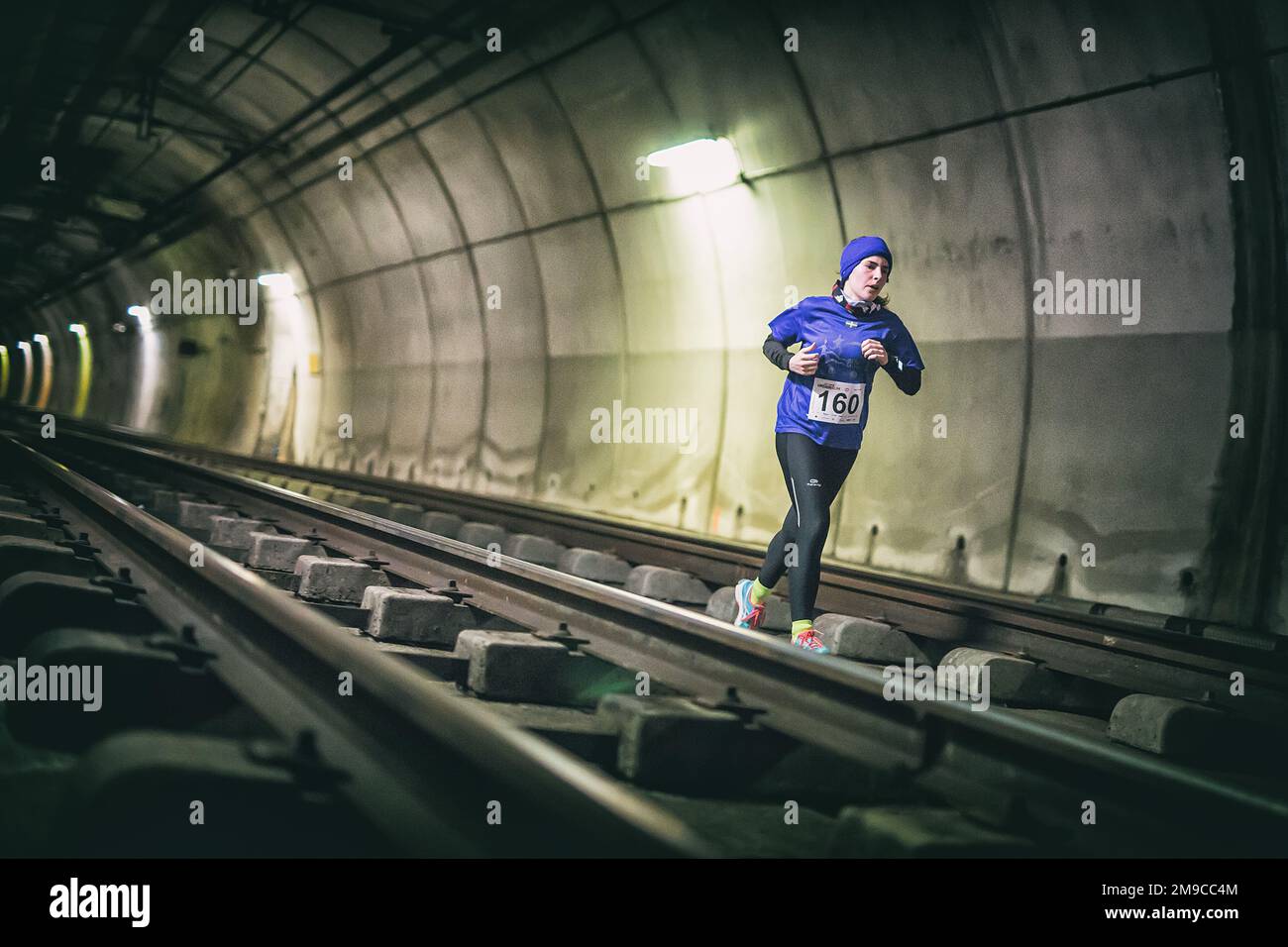 Runner running in a race in the Bilbao subway Stock Photo - Alamy