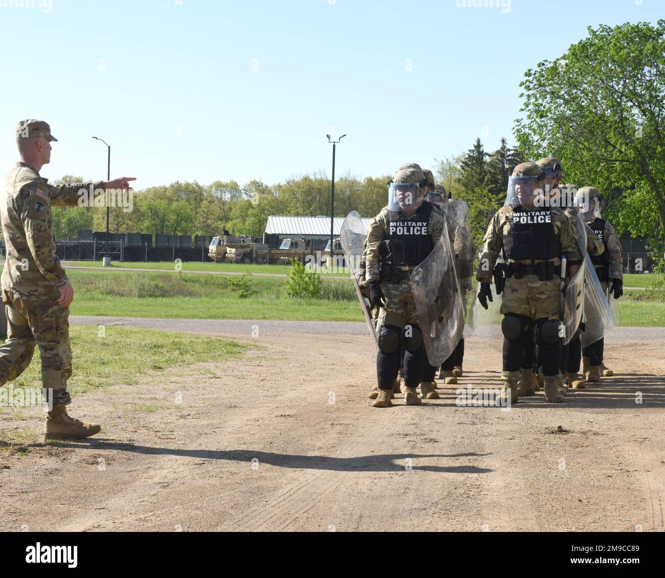 U.S. Army Staff Sgt. Scott Ramsey, left, military police course manager ...