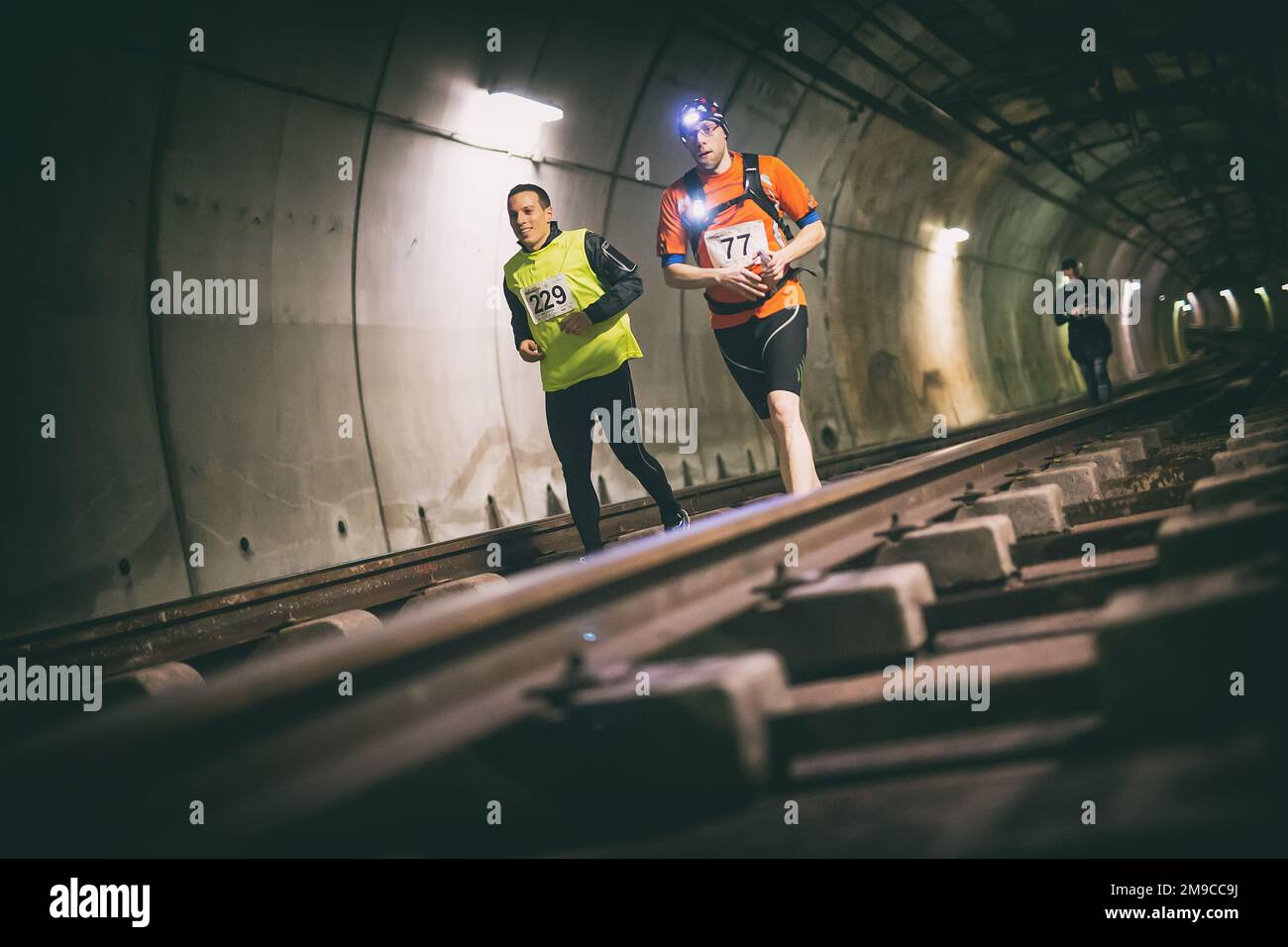 Runners running in a race in the Bilbao subway Stock Photo - Alamy