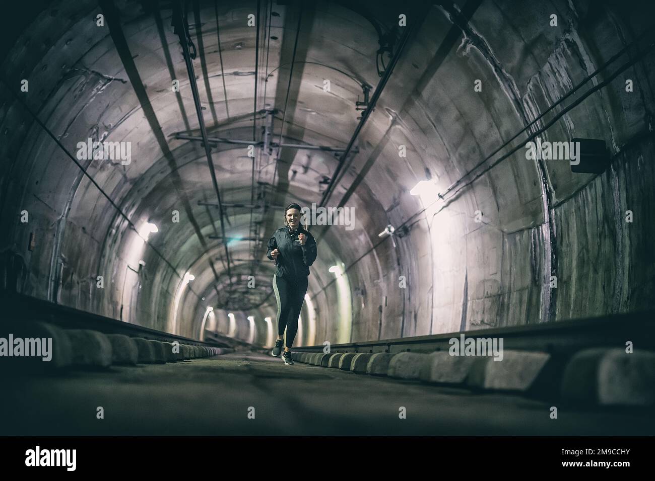 Runner running in a race in the Bilbao subway Stock Photo - Alamy