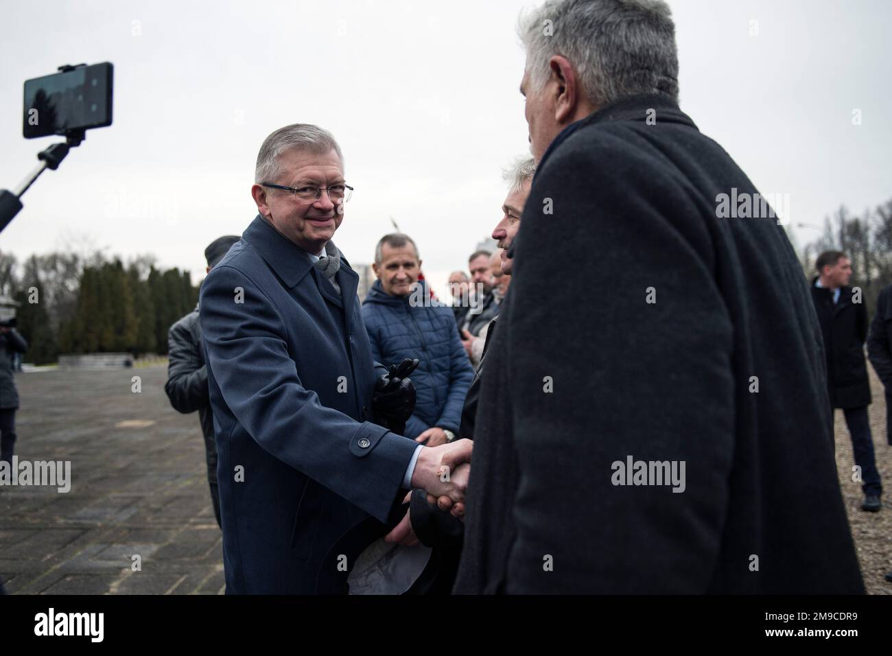The Russia's ambassador to Poland, Sergey Andreev shakes hands with his ...
