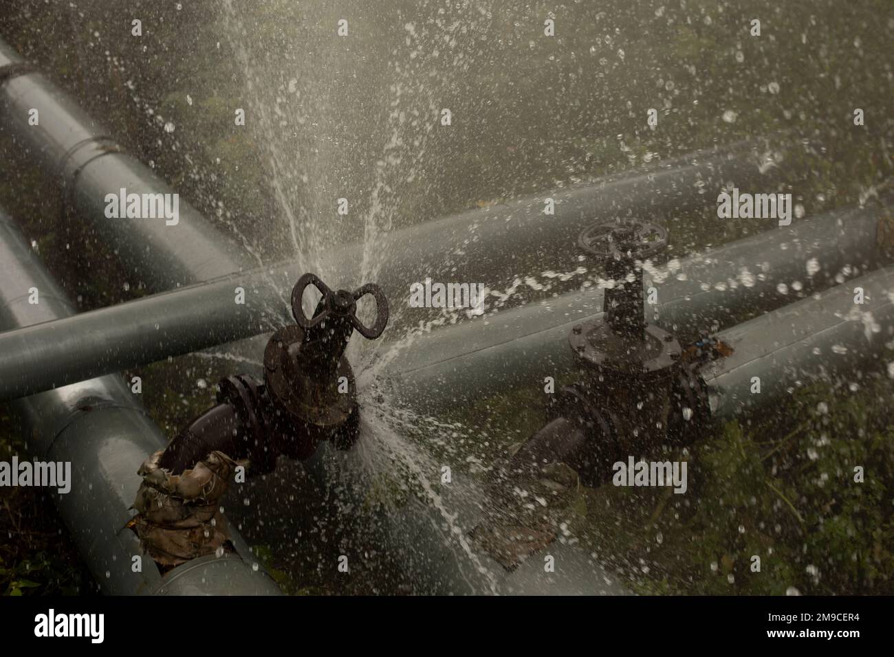 Pipeline burst. Water pours from pipes. Industrial disaster. Damage ...