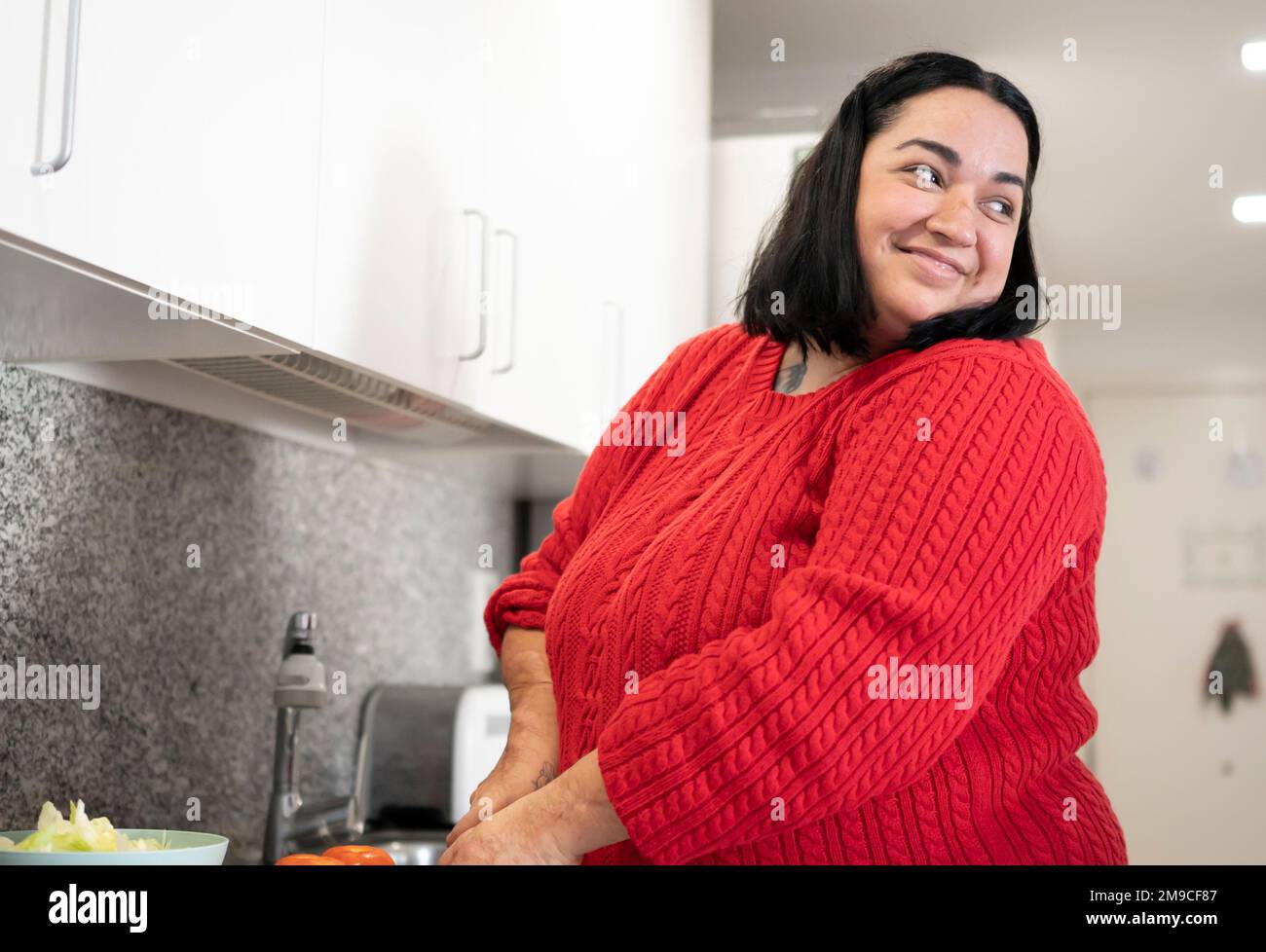 Physically disabled woman preparing lunch in the kitchen Stock Photo ...