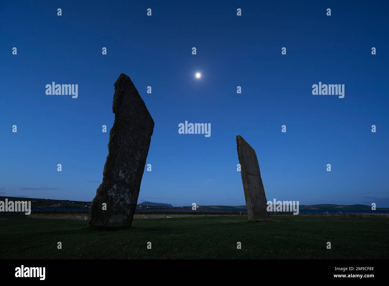 Fullmoon at dawn over standing stones of Stennes, Orkney, Scotland ...