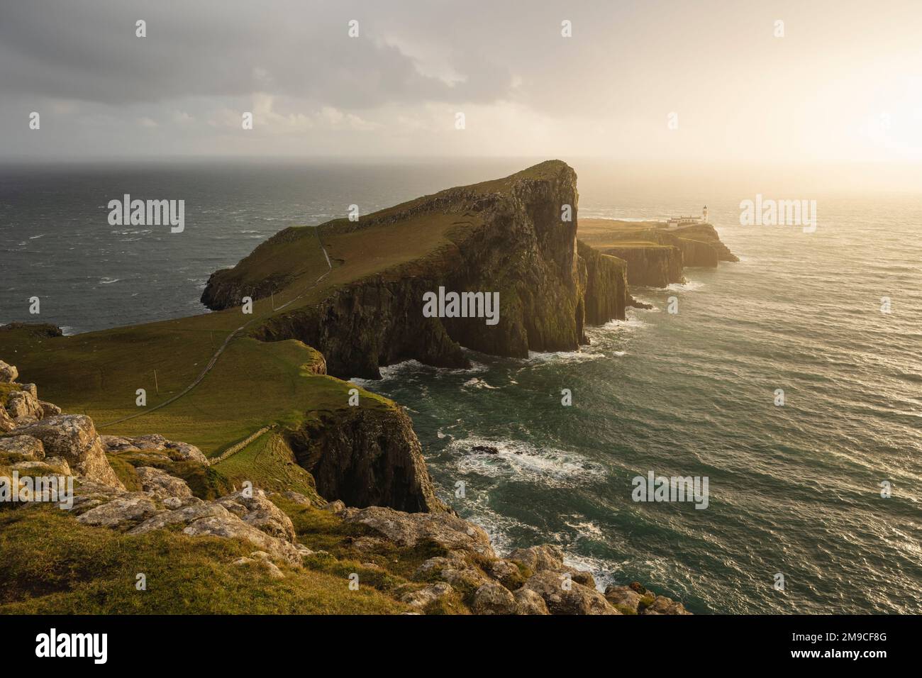 Sunset over Neist Point lighthouse, Isle of Skye, Scotland Stock Photo ...