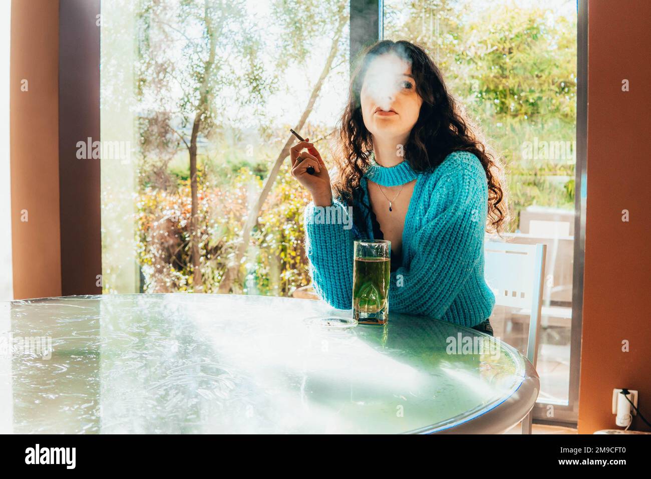 lonely woman drinking and smoking at home Stock Photo - Alamy