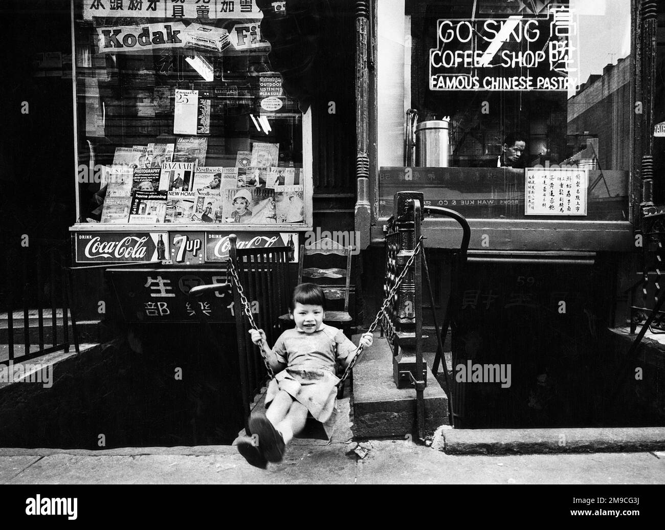 Young Girl Swinging in front of Go Sing Coffee Shop, Chinatown, New ...