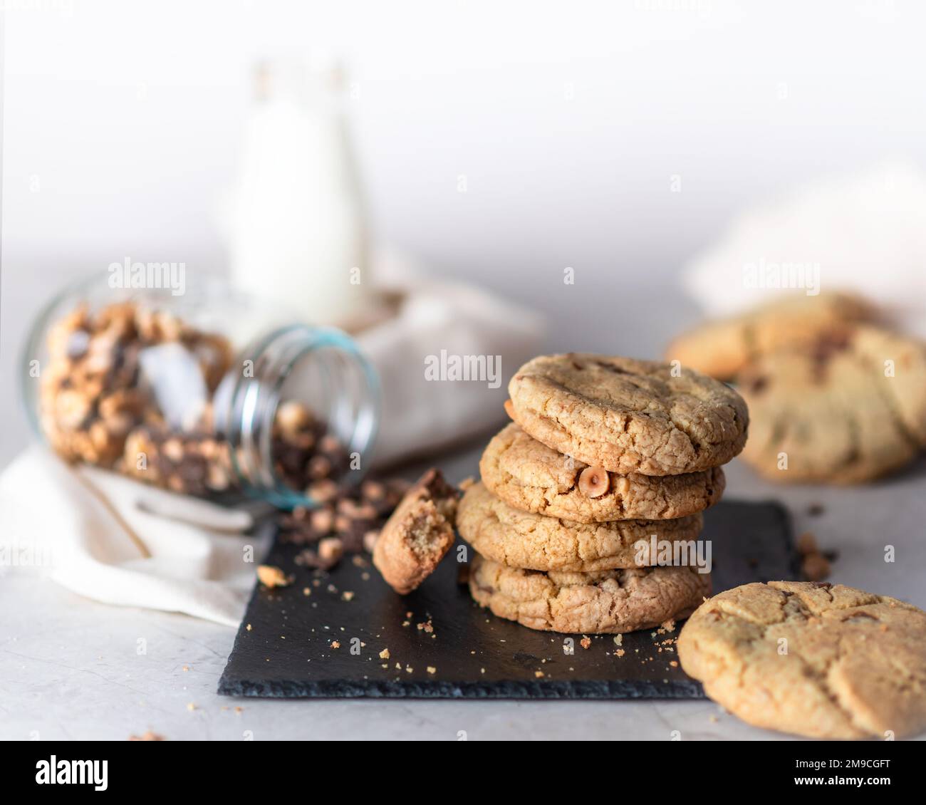 Chocolate chip and nuts cookies with milk food photography Stock Photo ...