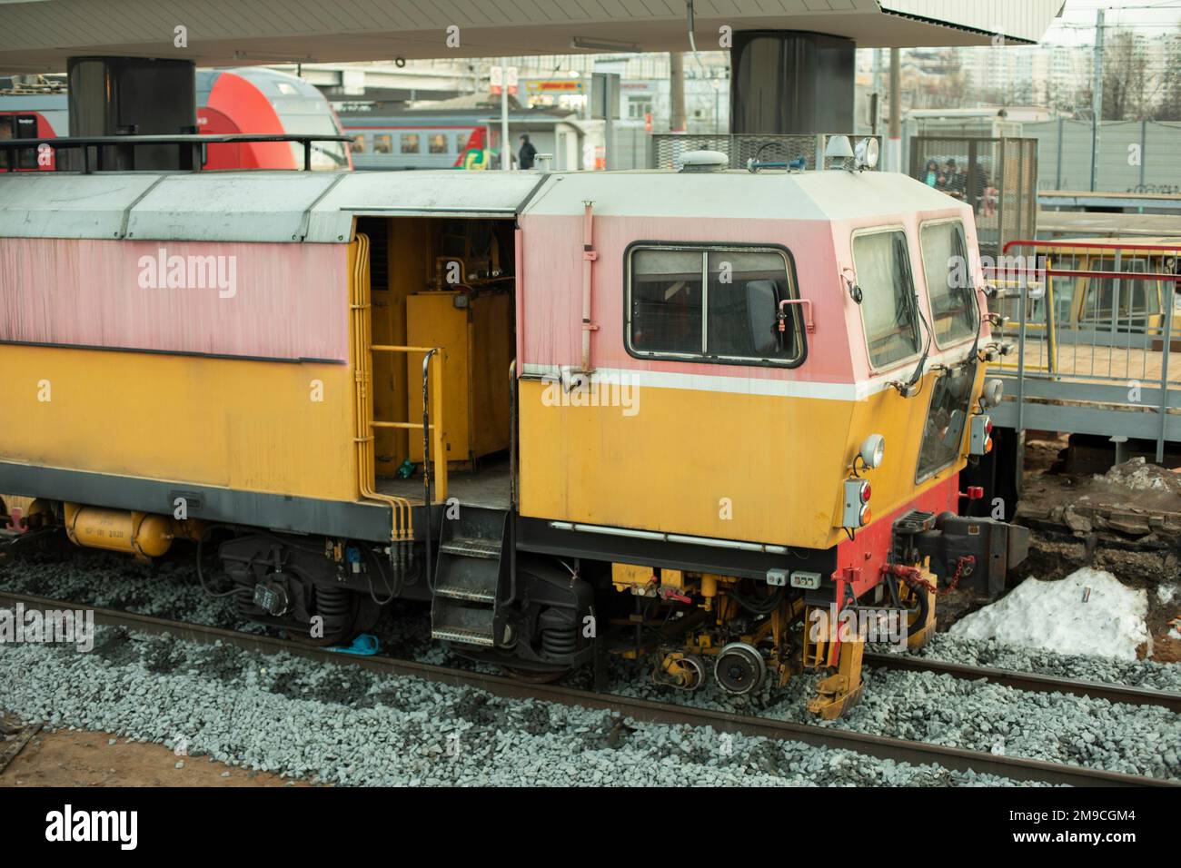 Repair of railway. Yellow train for laying railway tracks Stock Photo ...