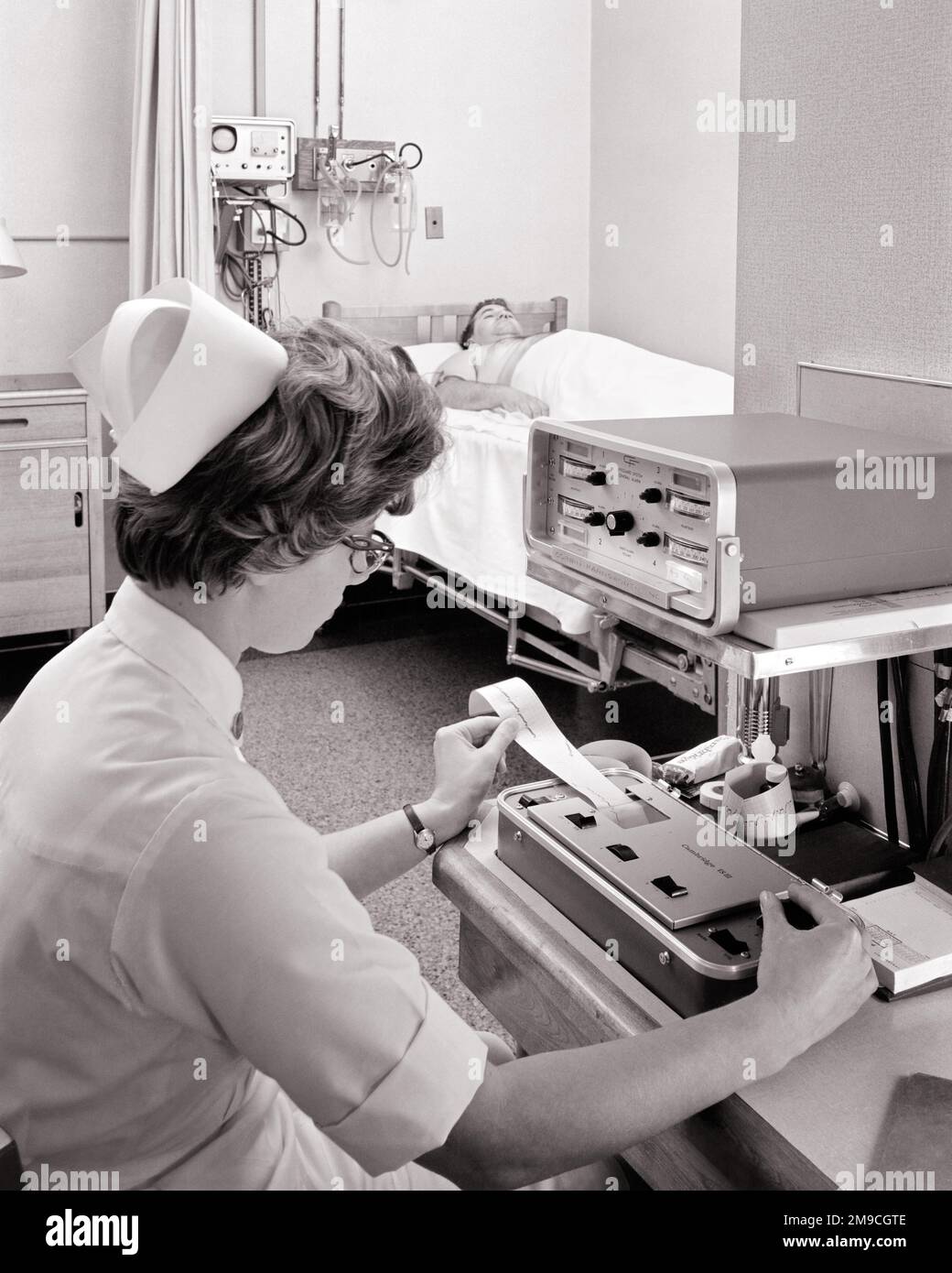 1970s NURSE WEARING CAP TAKING A PATIENT’S - m9658 HAR001 HARS ...