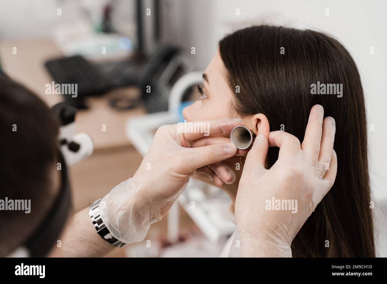 Consultation with otolaryngologist. Treatment of woman ear pain ...
