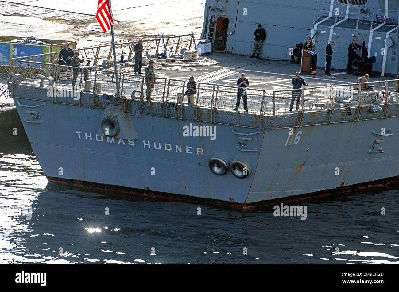 Sailors aboard the USS Thomas Hudner (DDG-116), berthed in the harbor ...