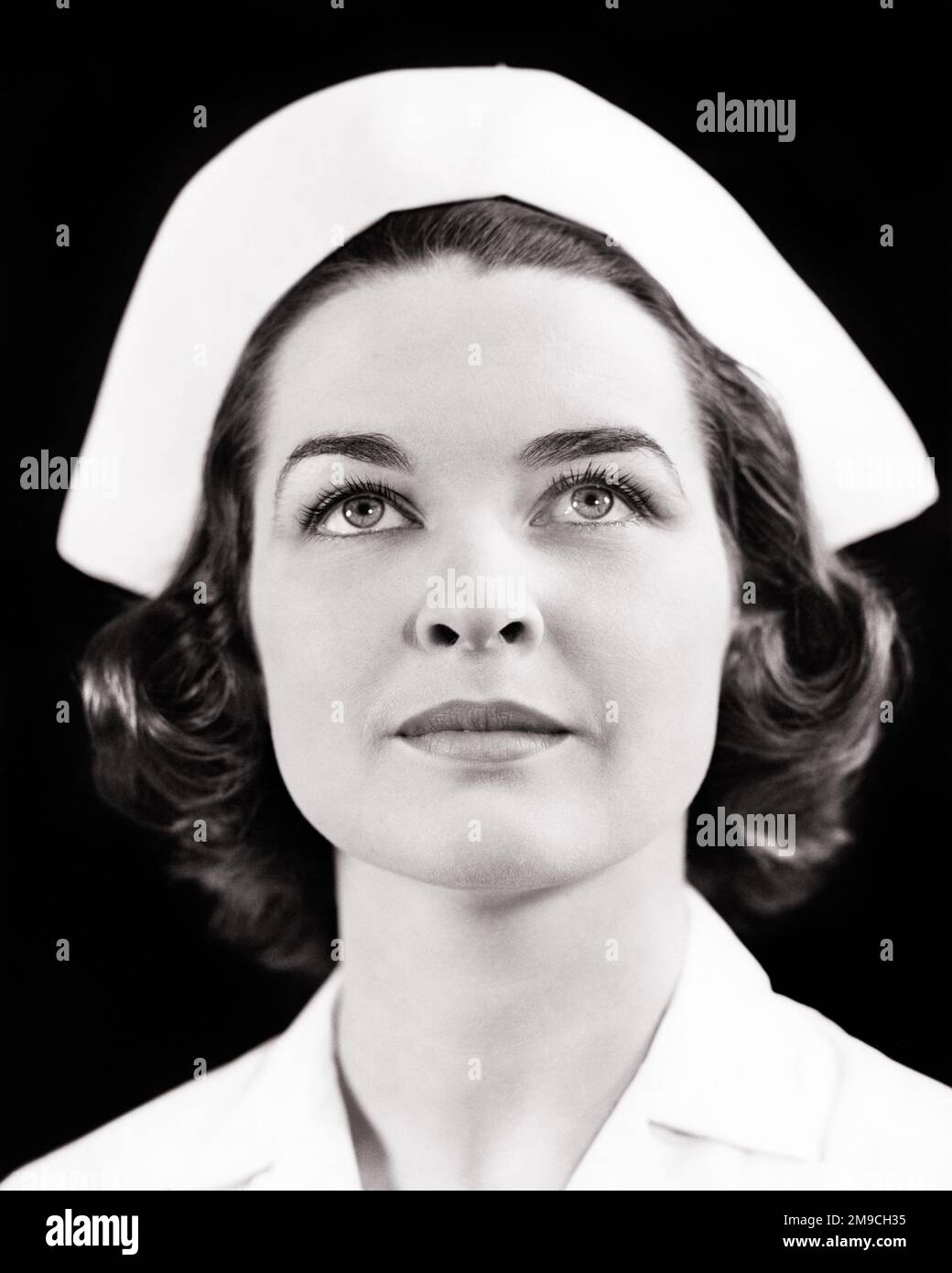 1930s 1940s HEAD ON PORTRAIT OF NURSE WEARING CAP LOOKING UP SERIOUS ...