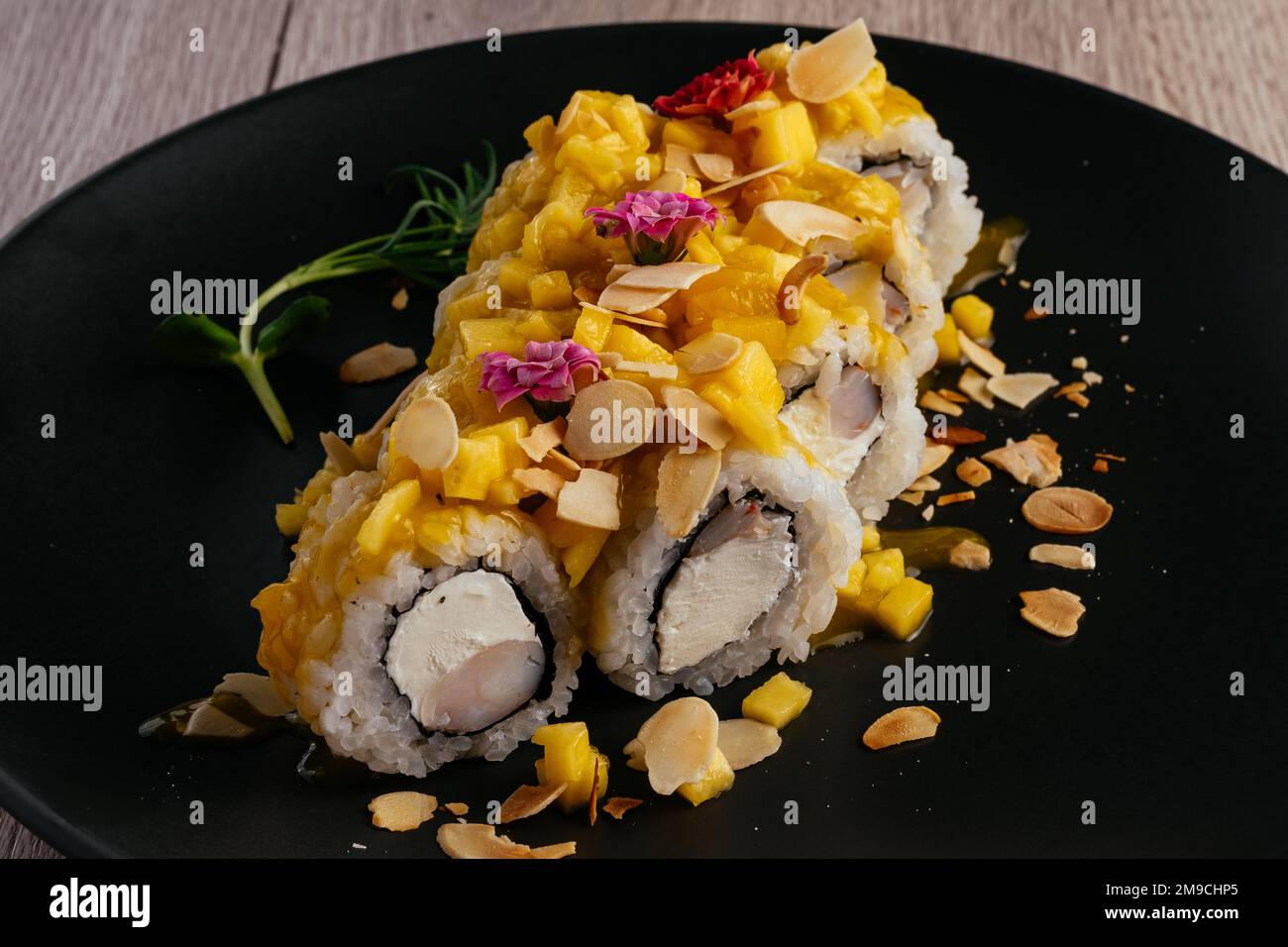 sushi rolls with mango and nuts Stock Photo - Alamy