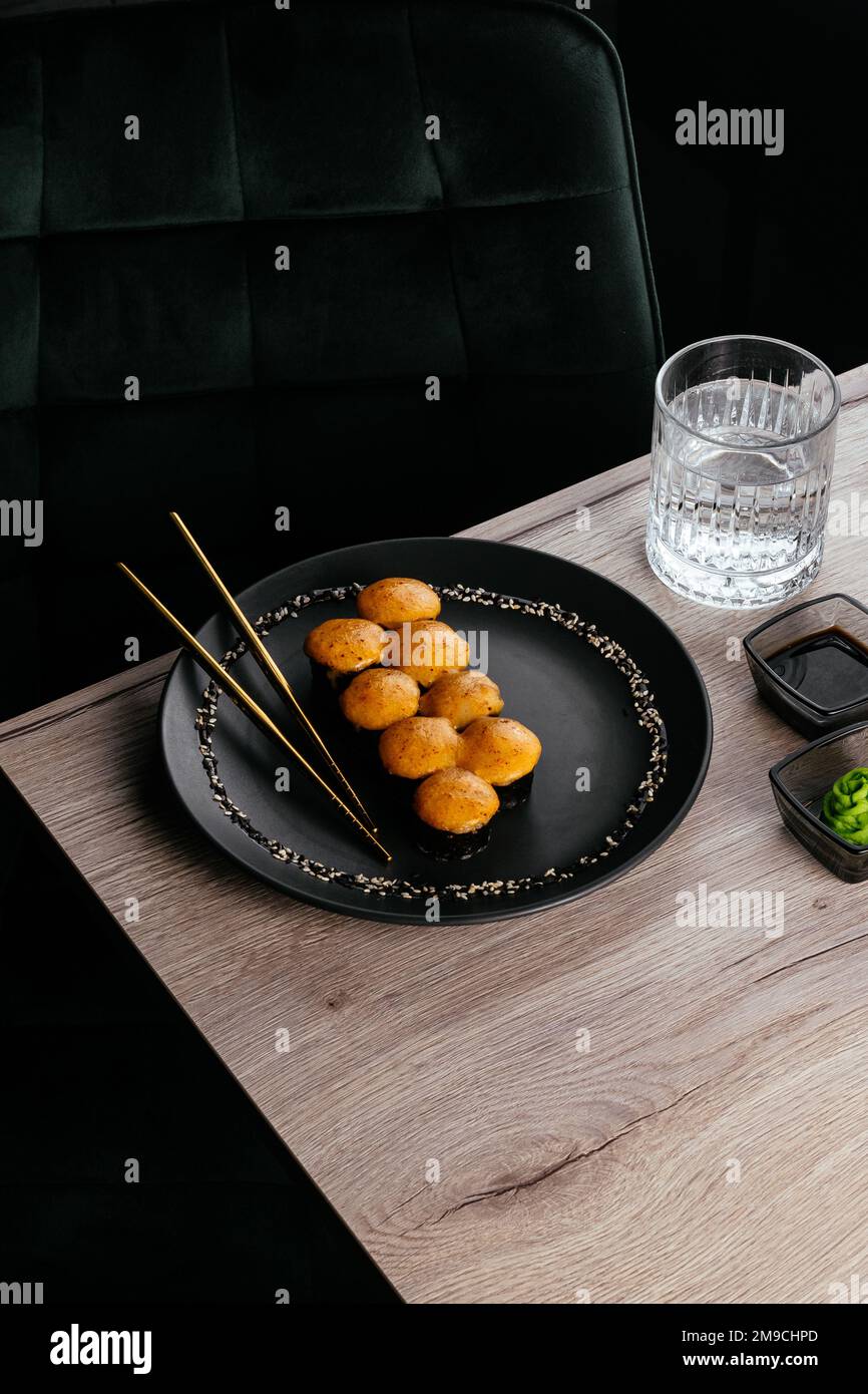 baked sushi rolls with cheese cap Stock Photo - Alamy