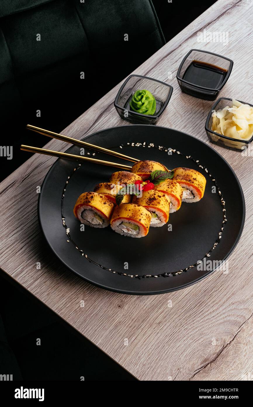 philadelphia sushi rolls with burnt cheddar cheese Stock Photo - Alamy